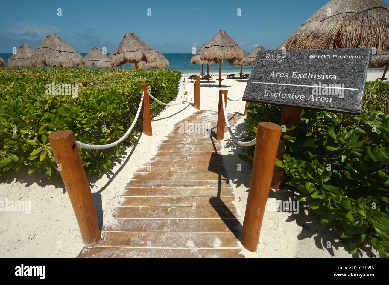 Exclusive beach area sign Stock Photo - Alamy