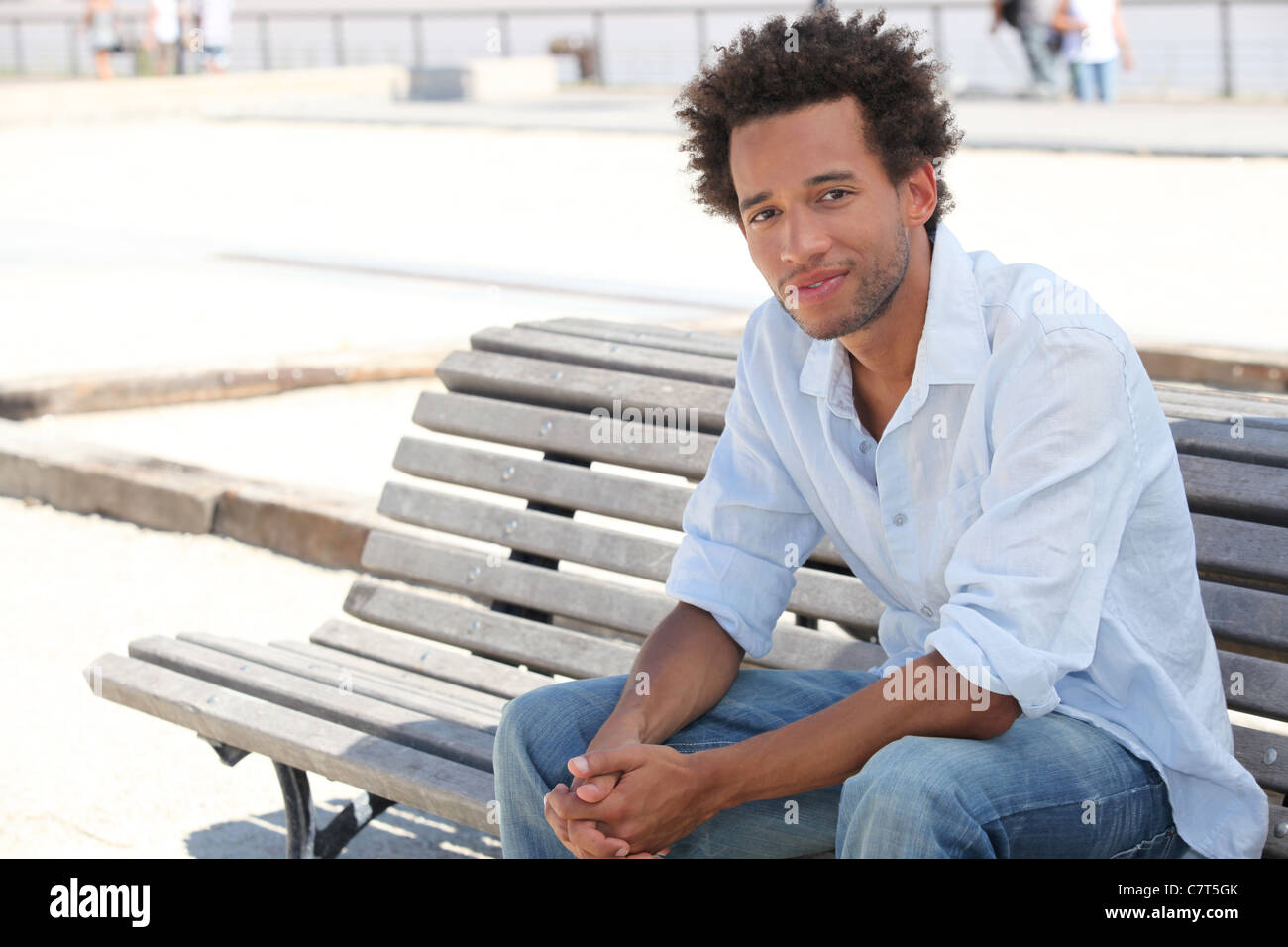 Man sat on bench Stock Photo - Alamy