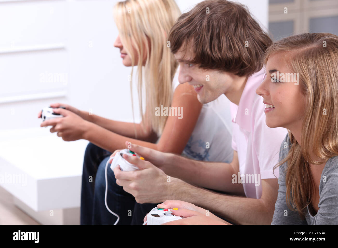 teenagers playing video games Stock Photo - Alamy