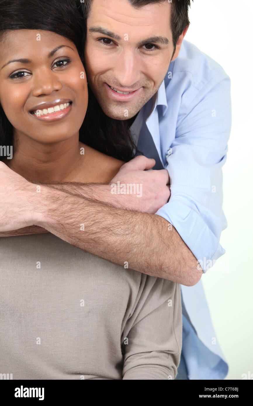 Couple embracing on white background Stock Photo - Alamy