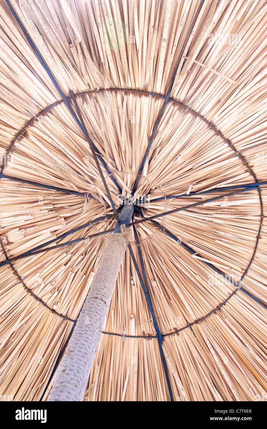 Beach straw umbrella background Stock Photo - Alamy