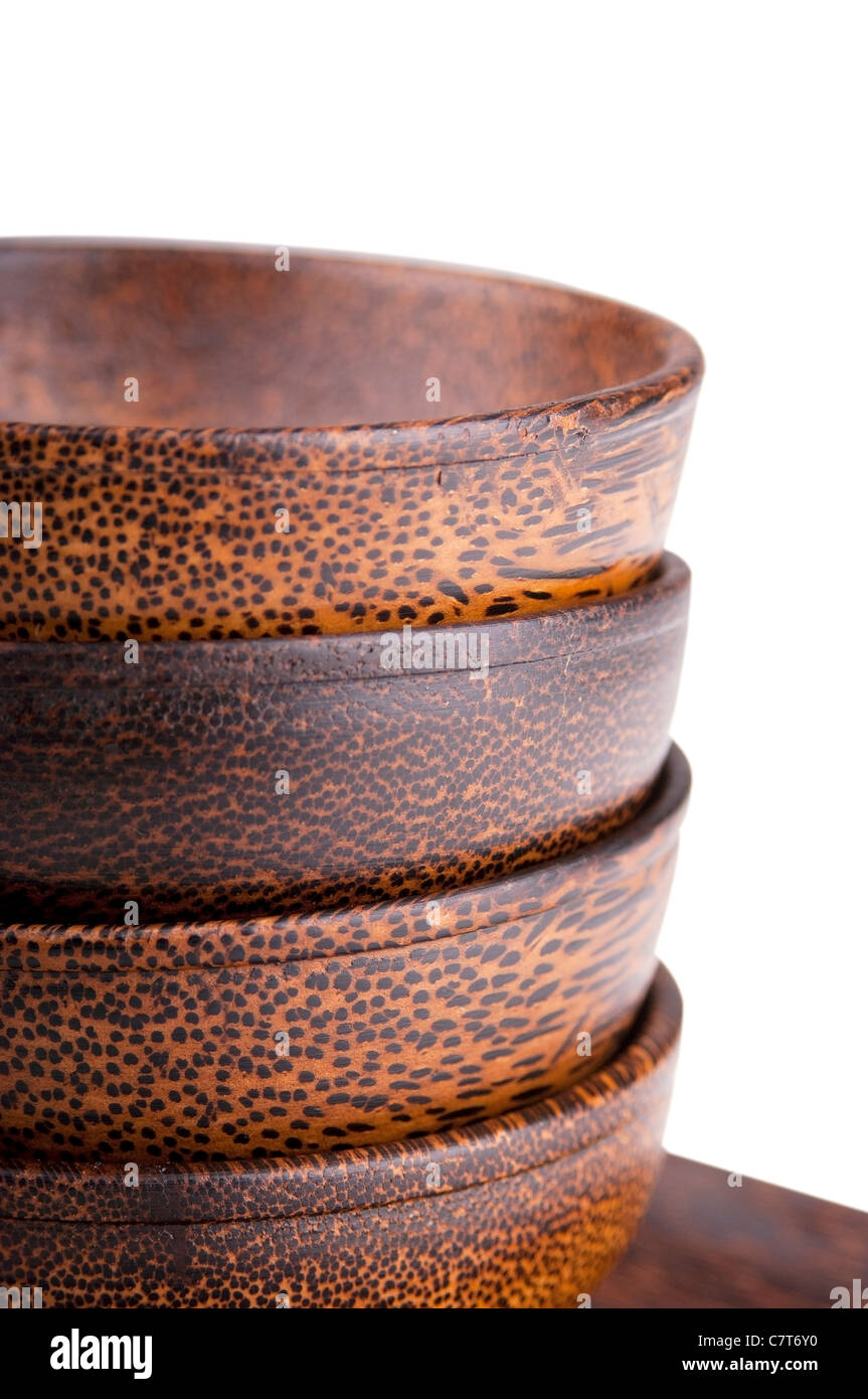 Exotic wooden bowls in a stack isolated over white Stock Photo - Alamy