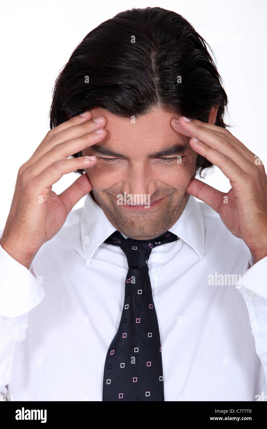Man with a headache Stock Photo - Alamy