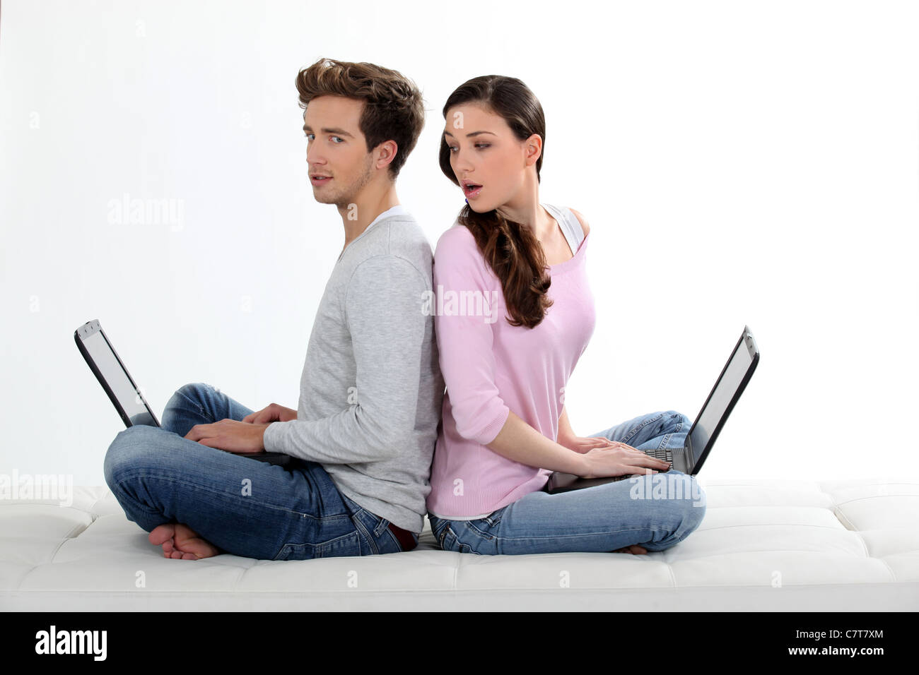 Woman peeking over a man's shoulder Stock Photo - Alamy