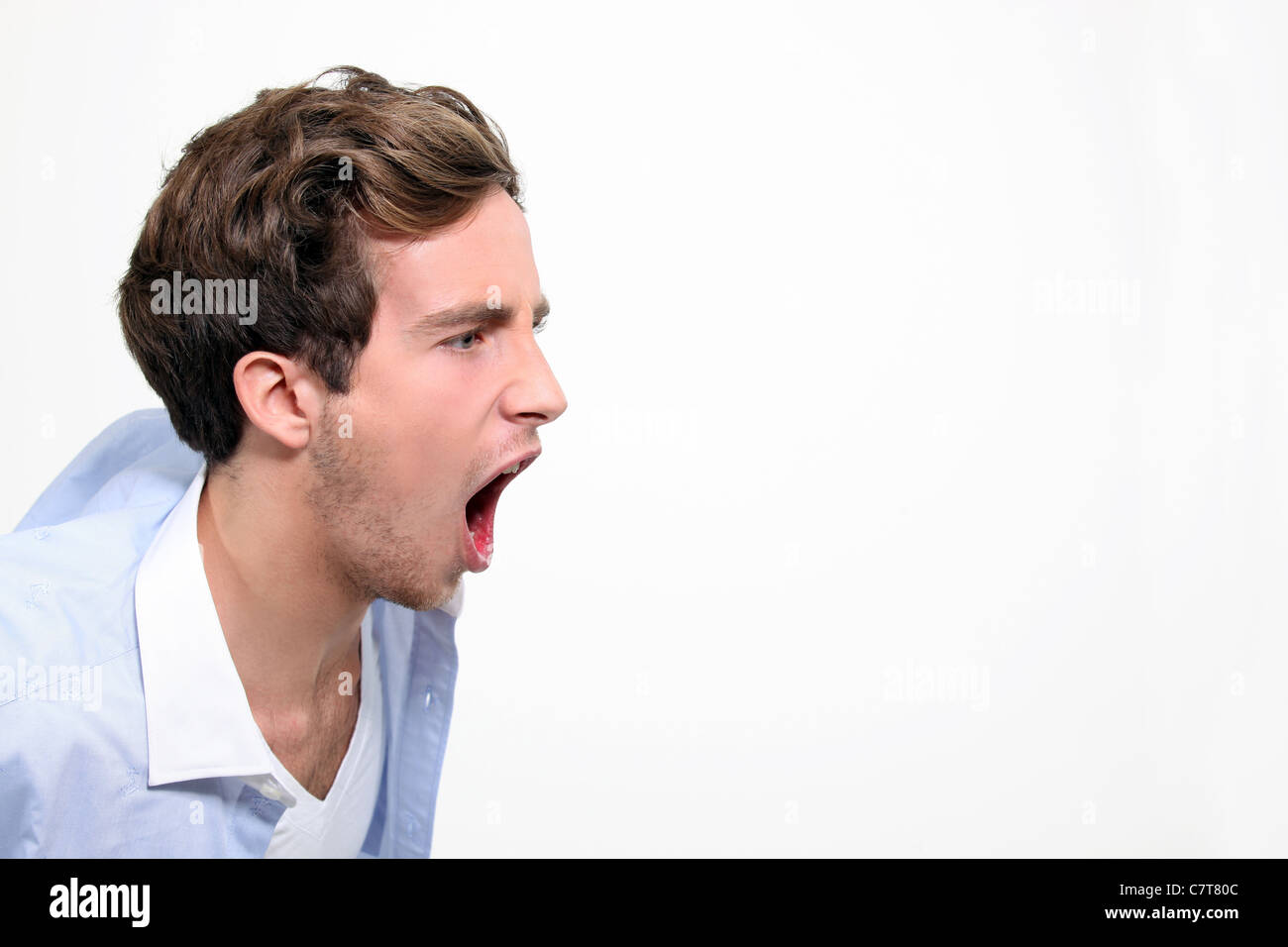 Young man screaming, studio shot Stock Photo - Alamy