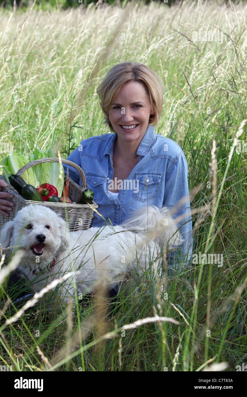 Woman and dog in the countryside Stock Photo - Alamy