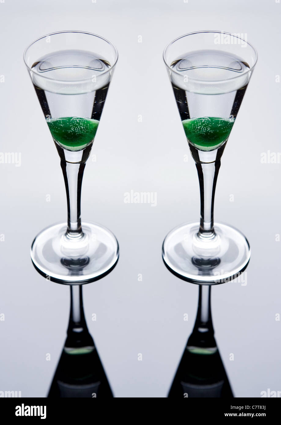 Two vodka martinis setting on a glass table Stock Photo - Alamy