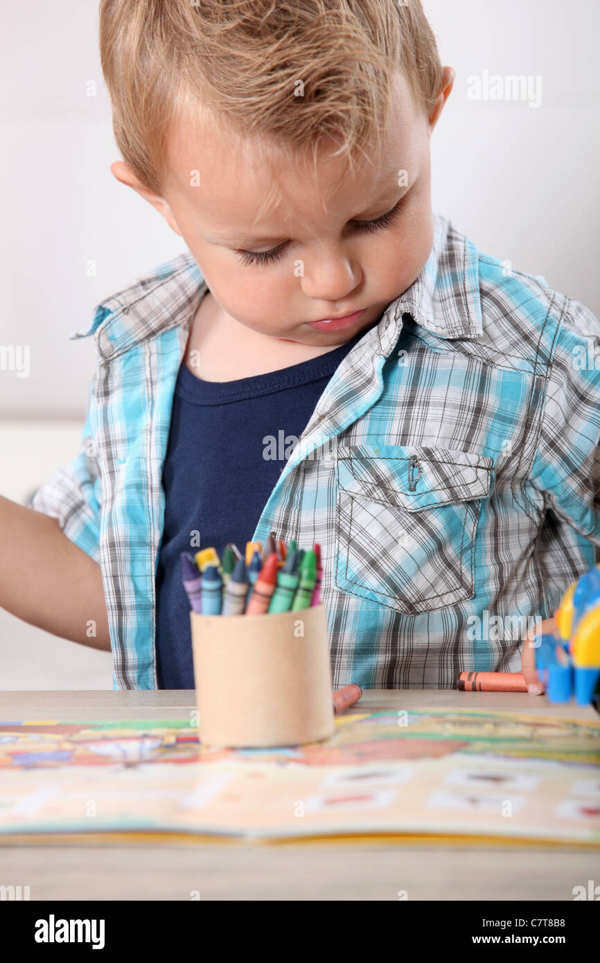 Little boy with crayons Stock Photo - Alamy