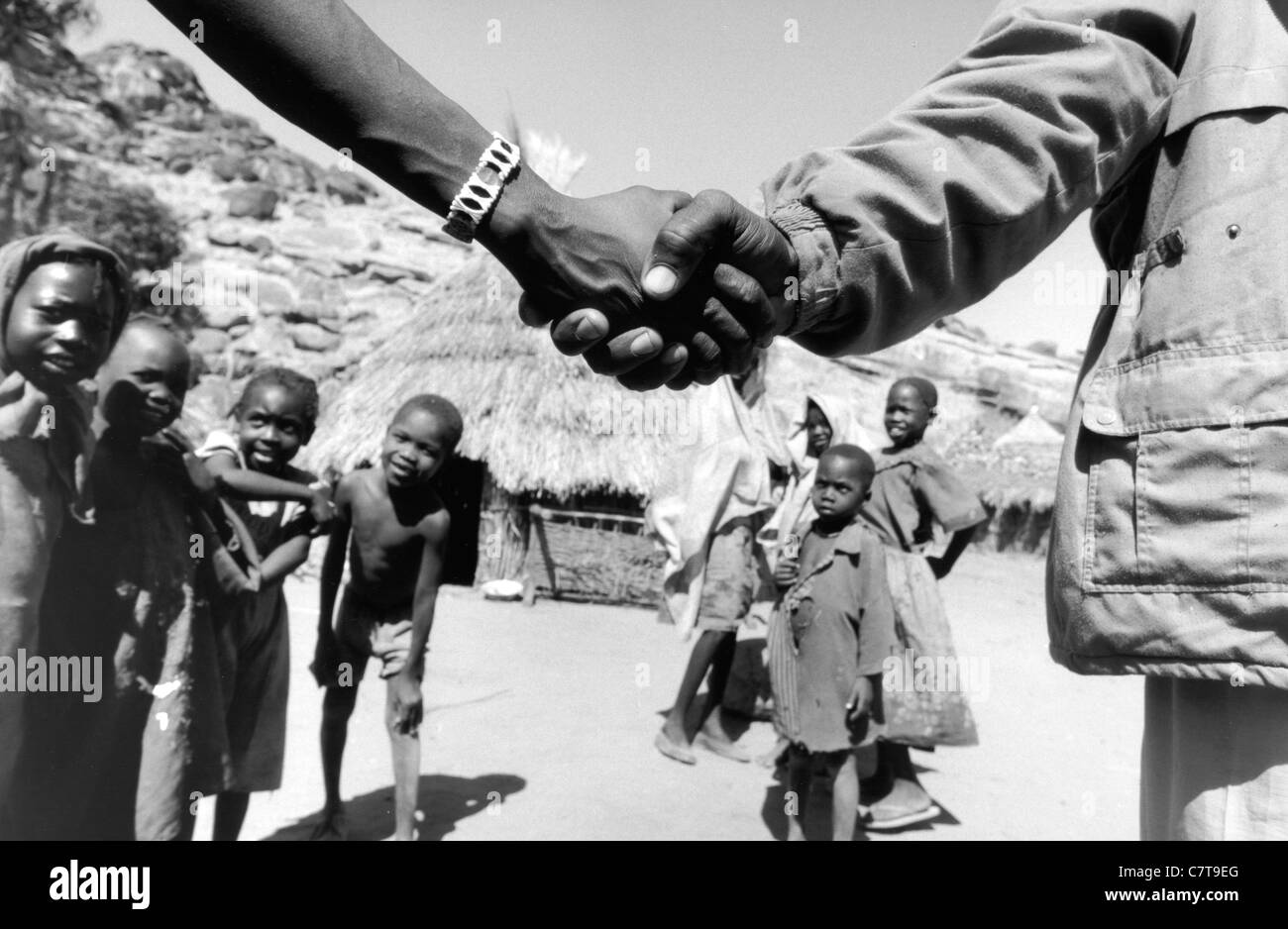Sudan, Kordofan, hand shaking between soldier and locals Stock Photo ...