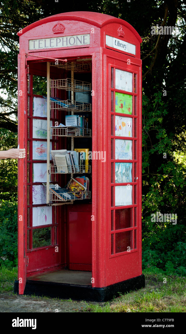 Disconnected British telephone kiosk re-used as village library (book ...