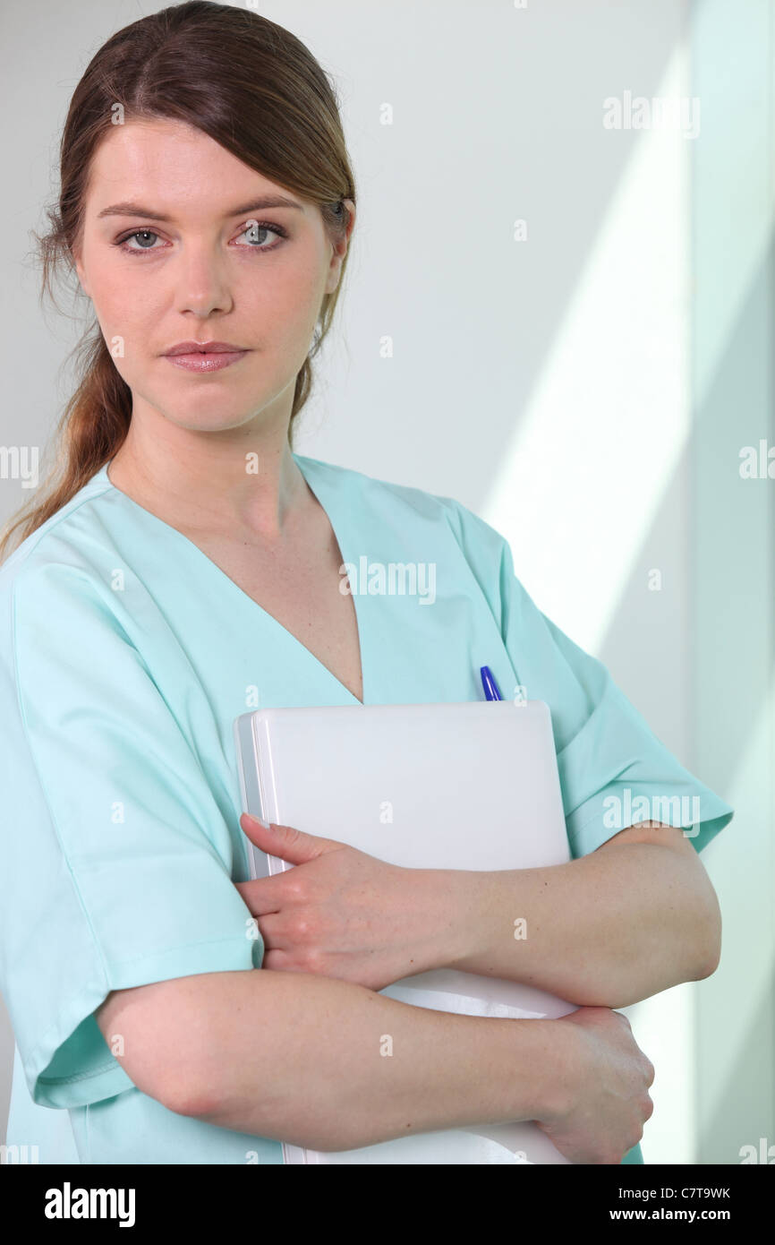 Nurse holding laptop Stock Photo - Alamy
