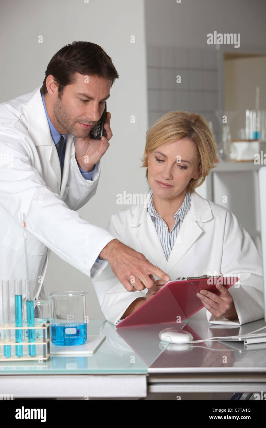 Man and woman working in a laboratory Stock Photo - Alamy