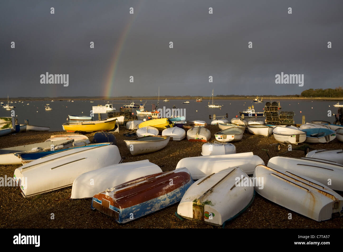 A rainbow over the water in a brooding, stormy sky Stock Photo - Alamy