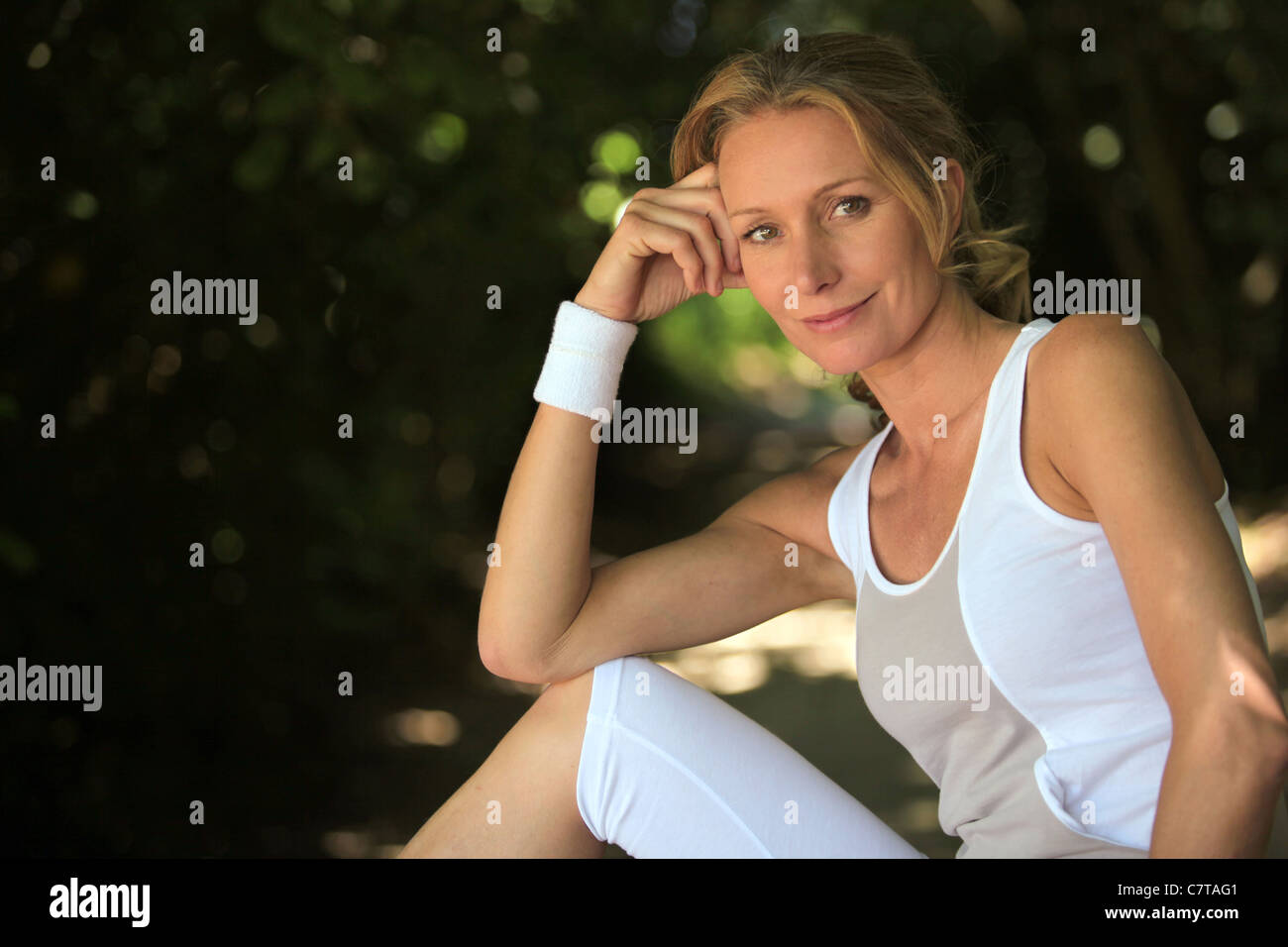 Woman resting after exercise Stock Photo - Alamy