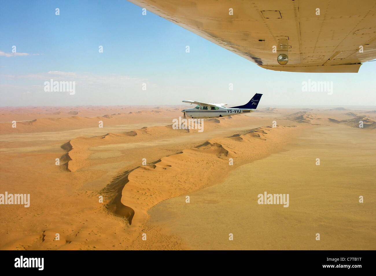 Africa, Namibia, aerial view of the desert and Cessna 210 airplane ...