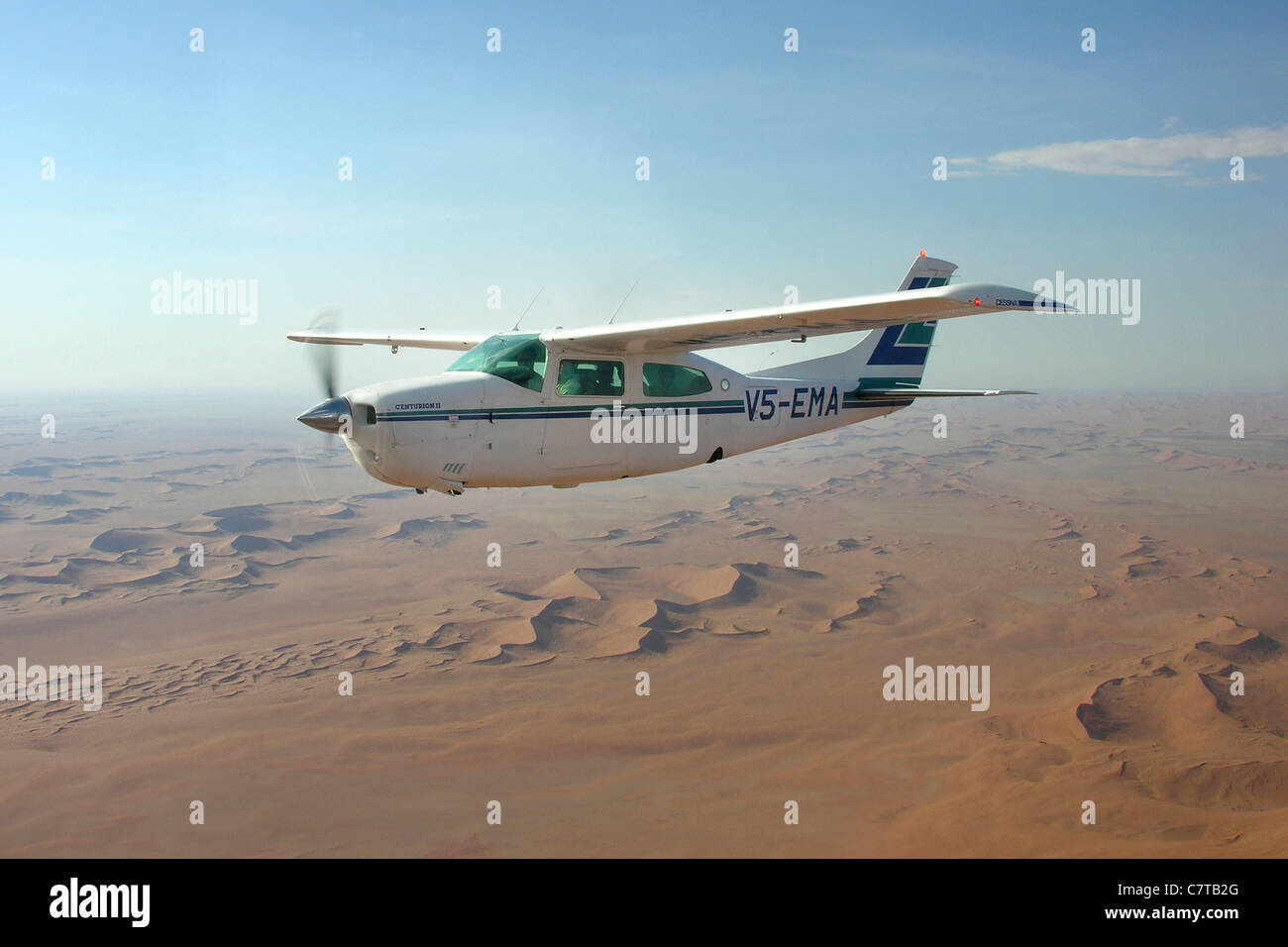 Africa, Namibia, aerial view of the desert and Cessna 210 airplane ...