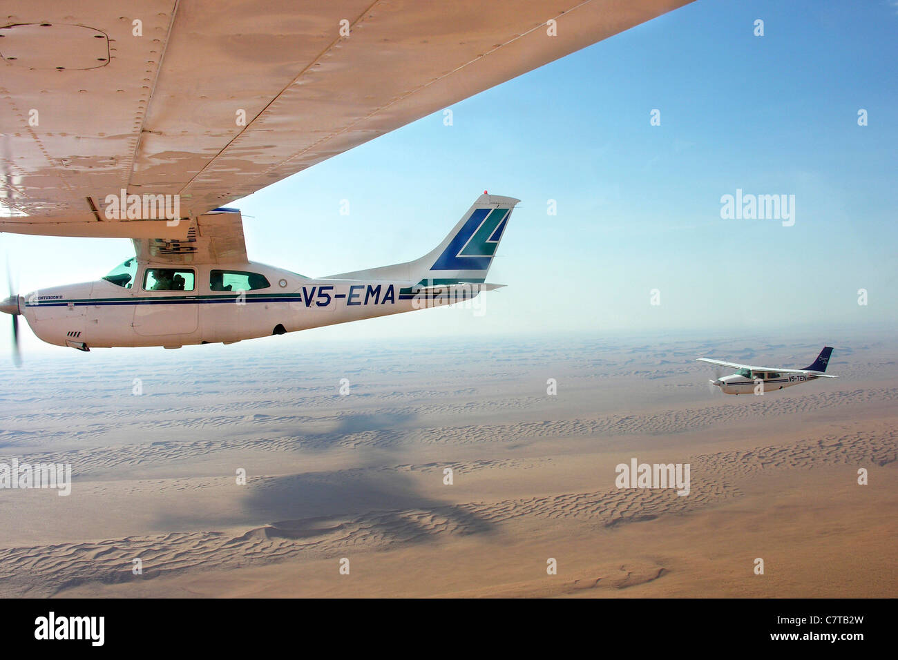 Africa, Namibia, aerial view of the desert and Cessna 210 airplane ...