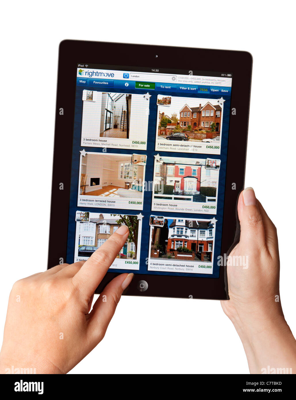 Hands holding iPad searching for a house for sale on the Rightmove app ...