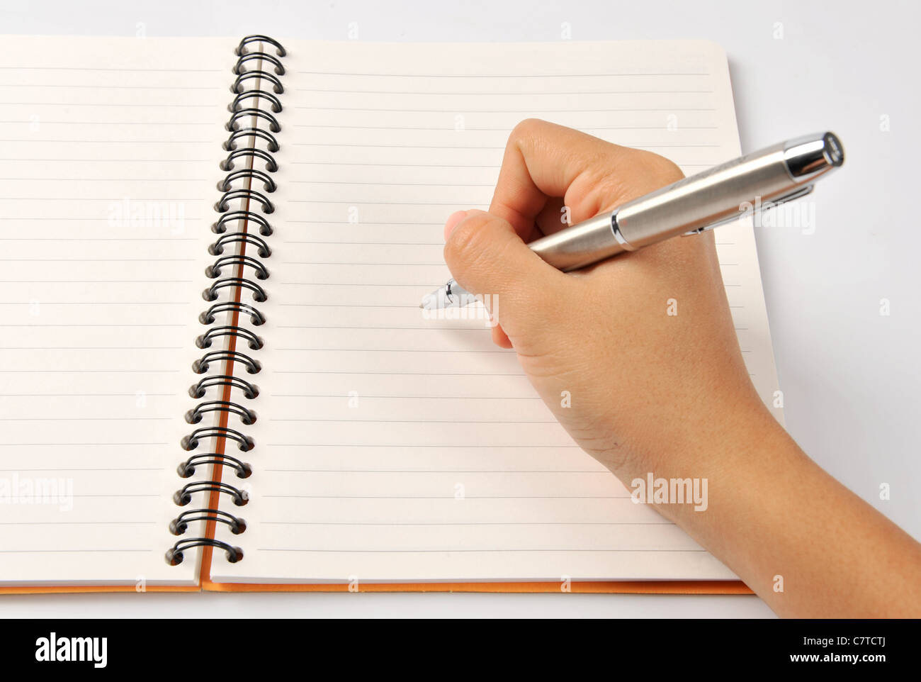 Notebook in hand. Pen in hand. Isolated on white background Stock Photo ...