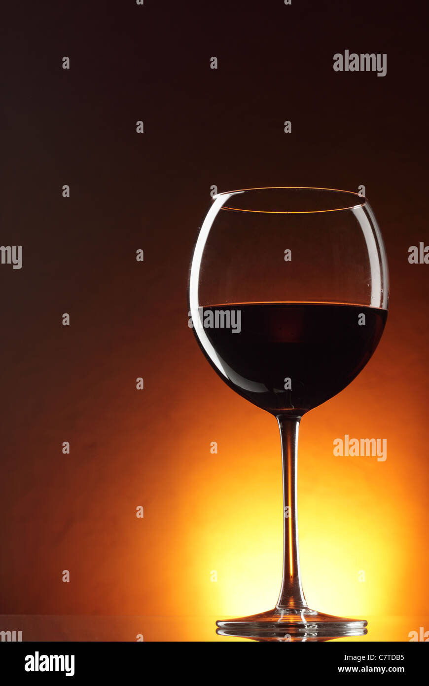 Glass of red wine over dark background Stock Photo - Alamy