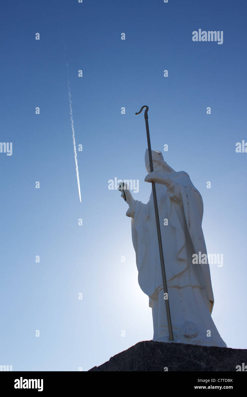 The statue of st Patrick with the blue sky and Croagh Patrick mountain ...