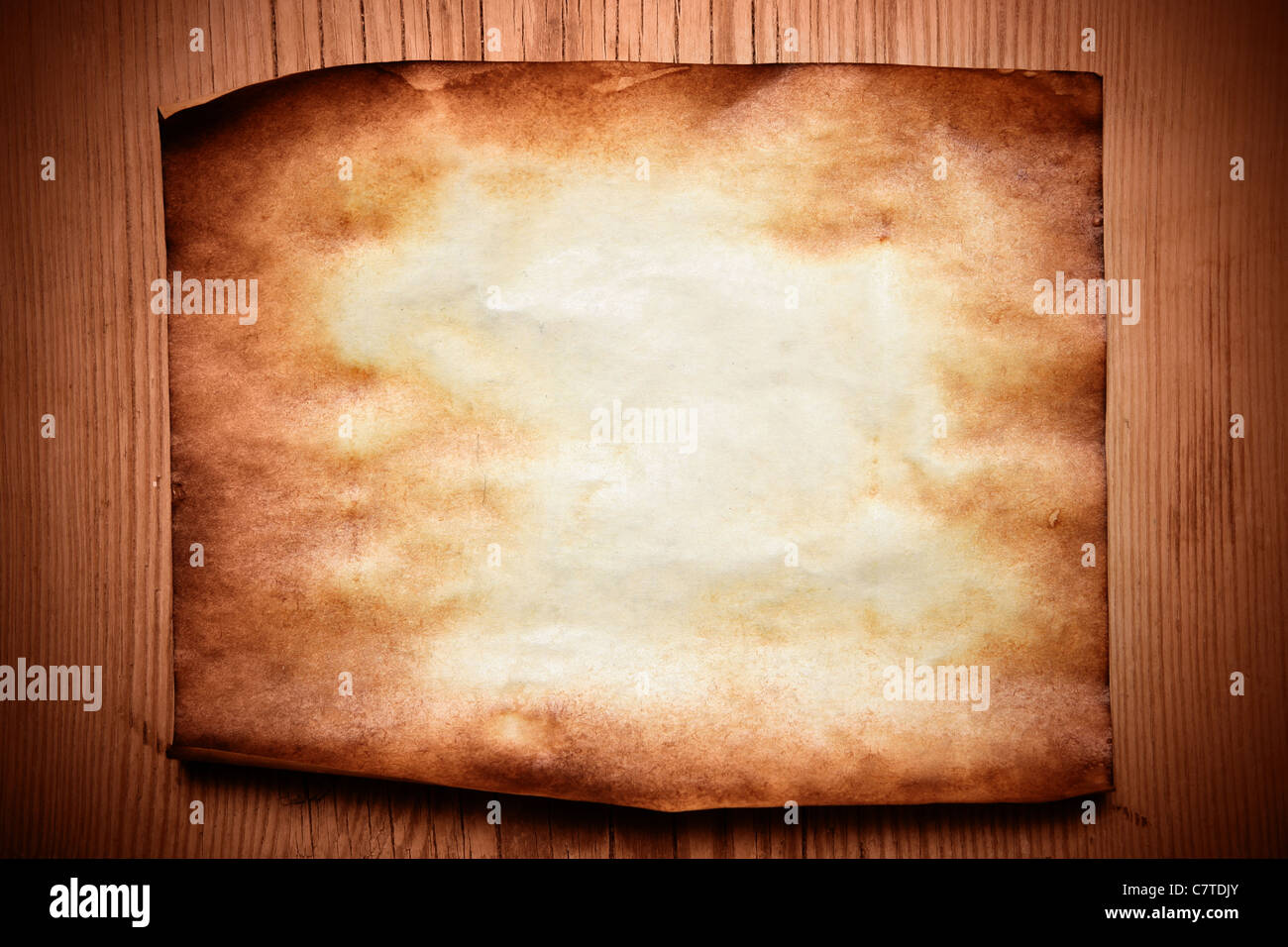 Old paper close up on wooden table Stock Photo - Alamy