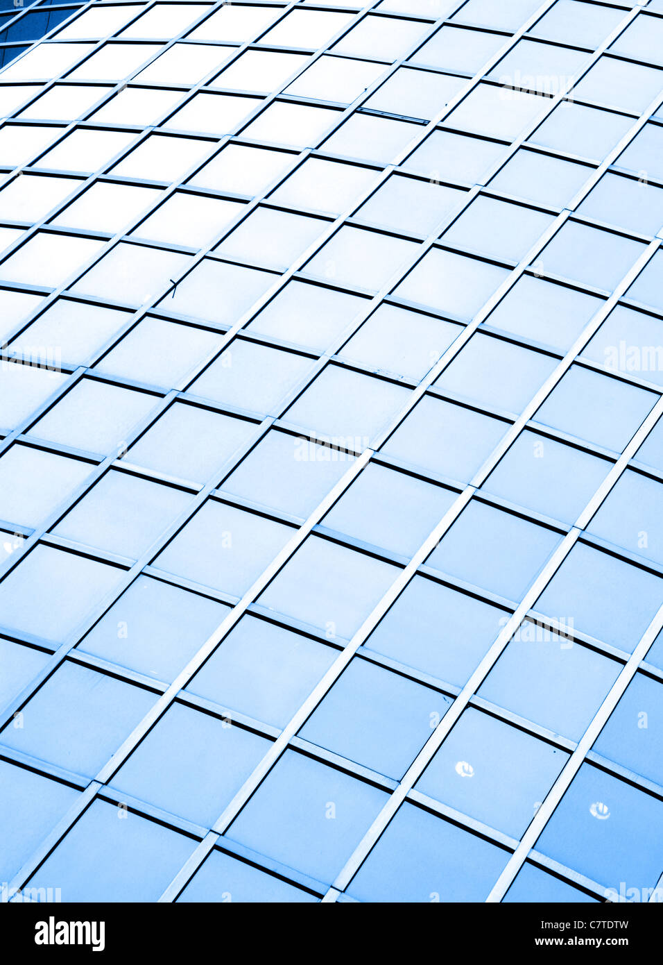 Windows of modern building toned in blue color Stock Photo - Alamy