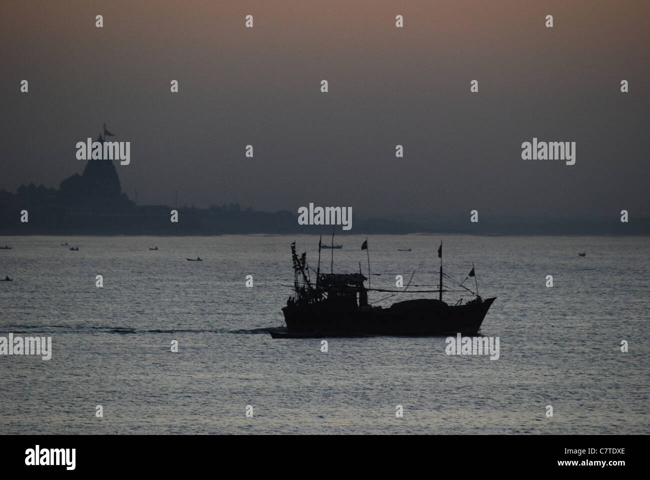 A trailer is leaving the port of Veraval situated on the Arabian sea ...