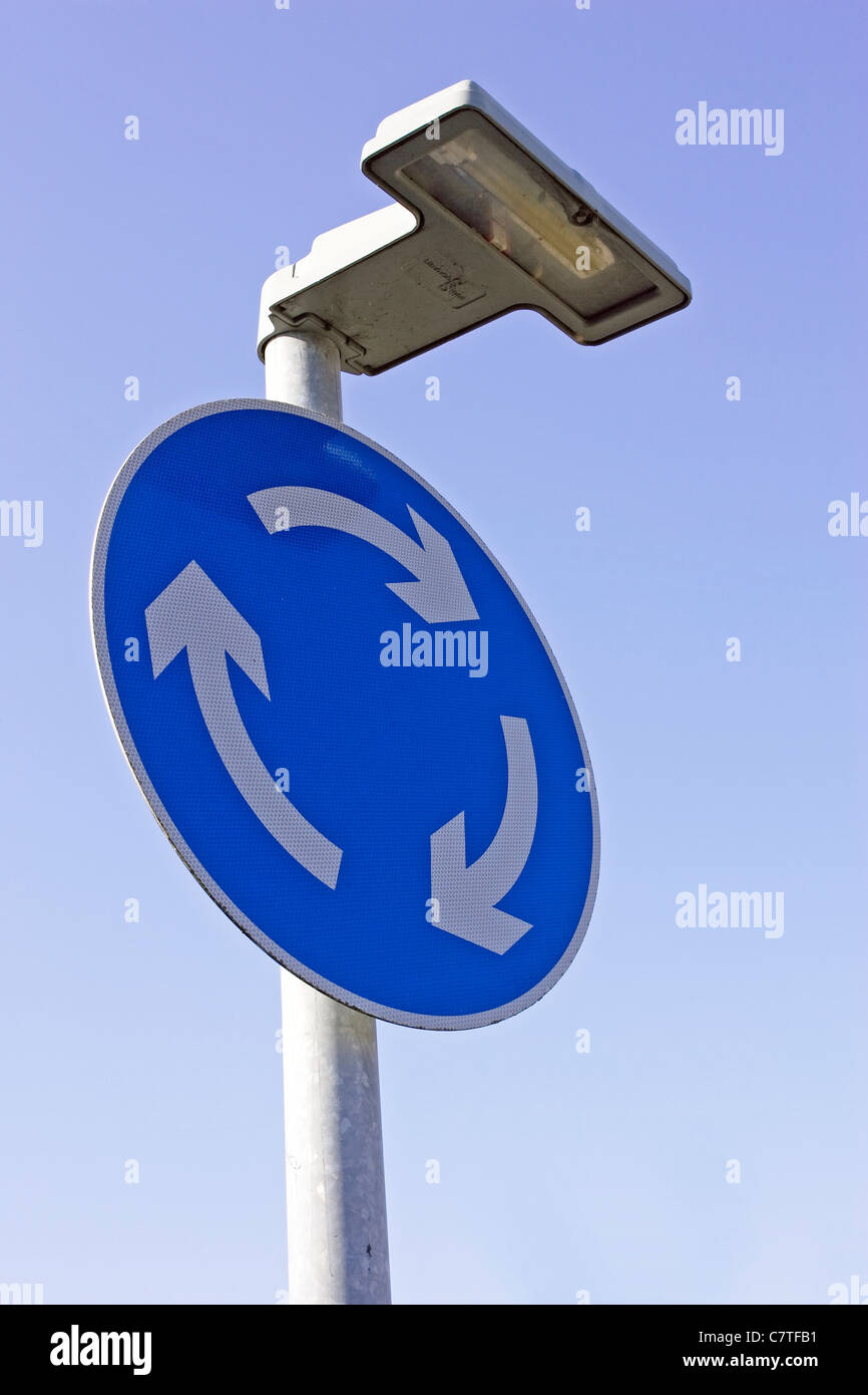 A traffic control sign showing a roundabout Stock Photo - Alamy