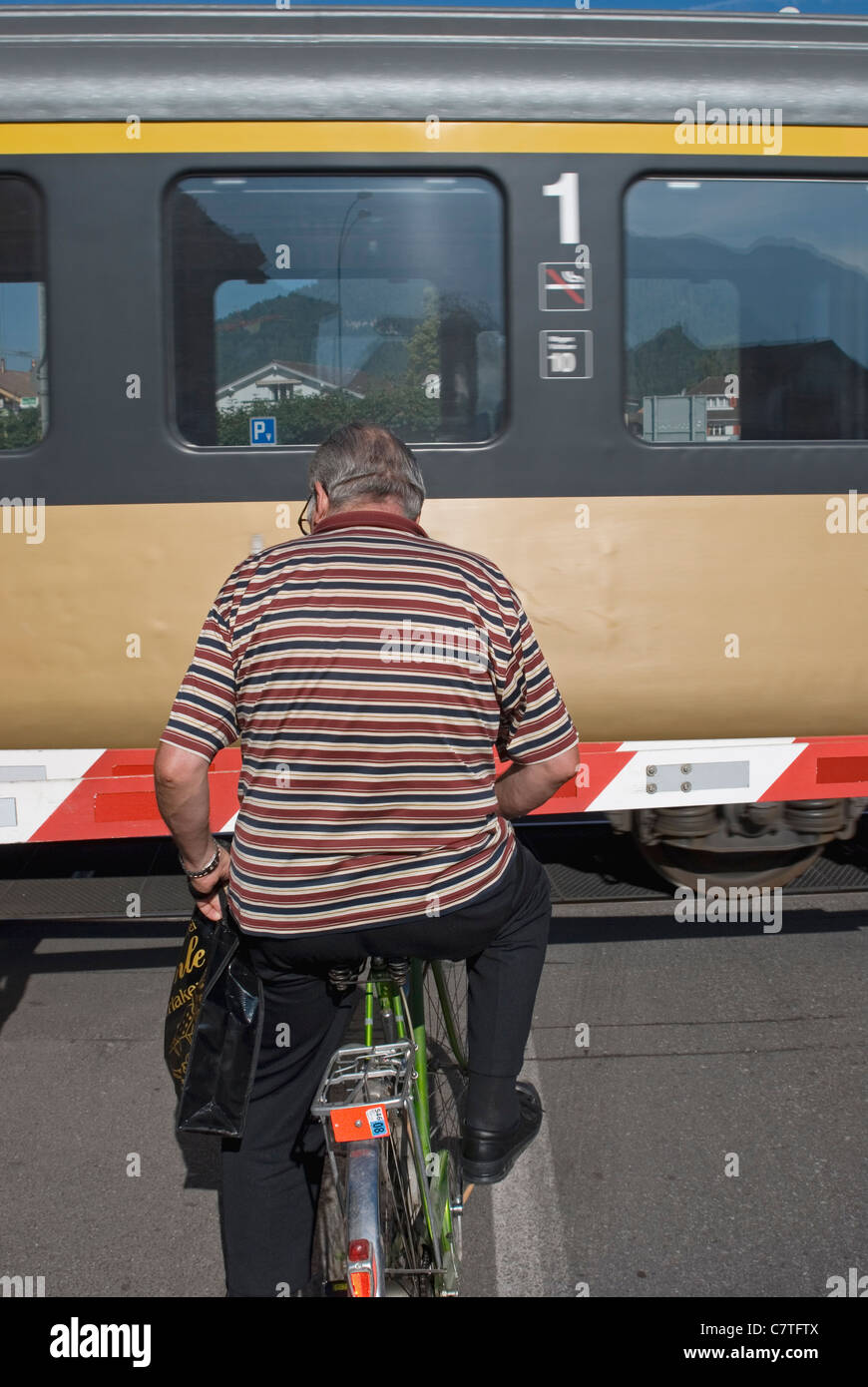Cyclist waiting at level crossing hi-res stock photography and images ...