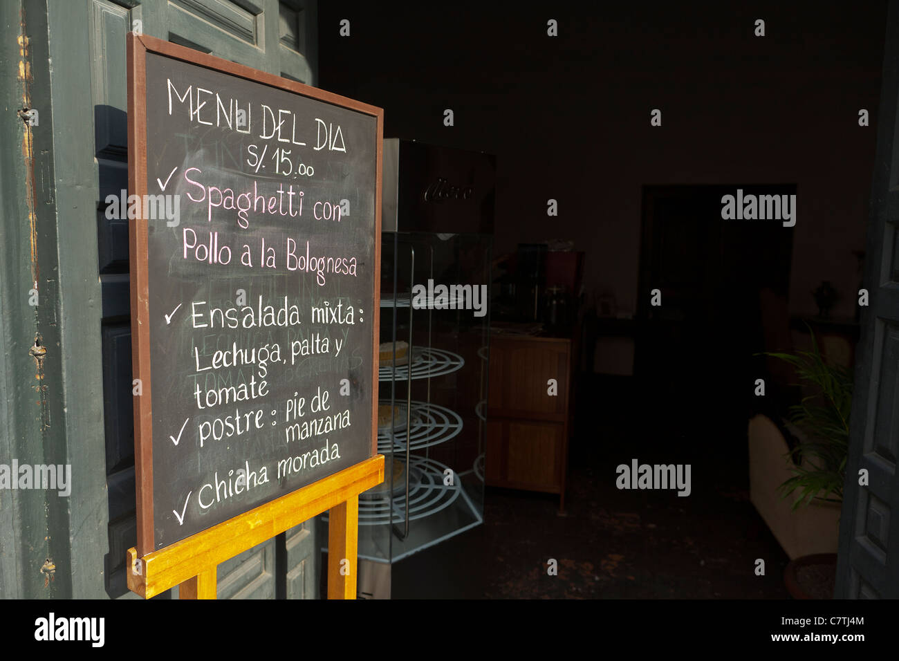 A chalkboard with the meal of the day in front of a restaurant in ...