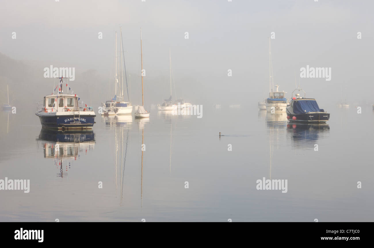 Boats in morning mist on Kingsbridge Estuary, Salcombe, Devon, England ...