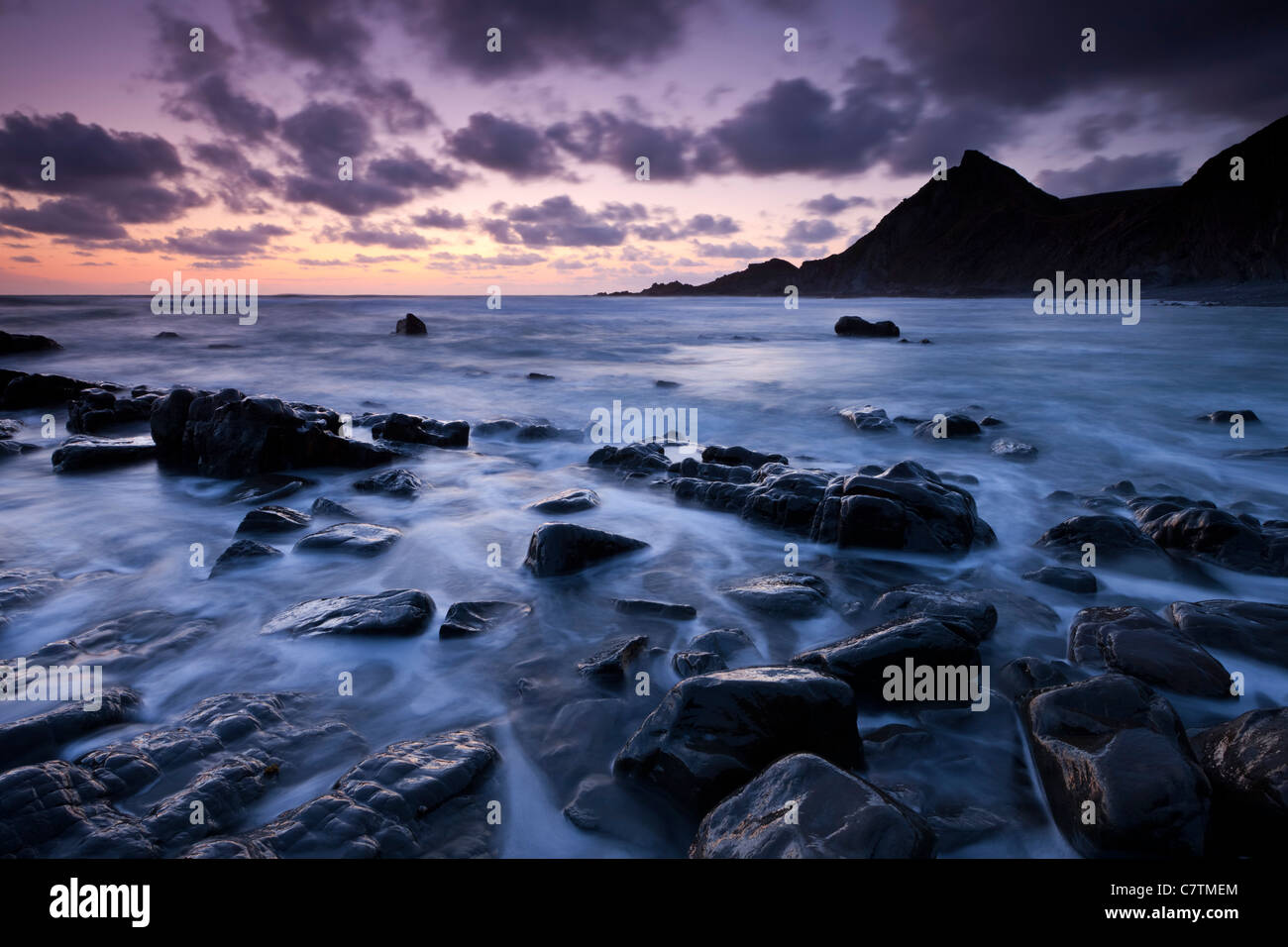 Twilight over the rocky shores of Spekes Mill Mouth, North Devon ...