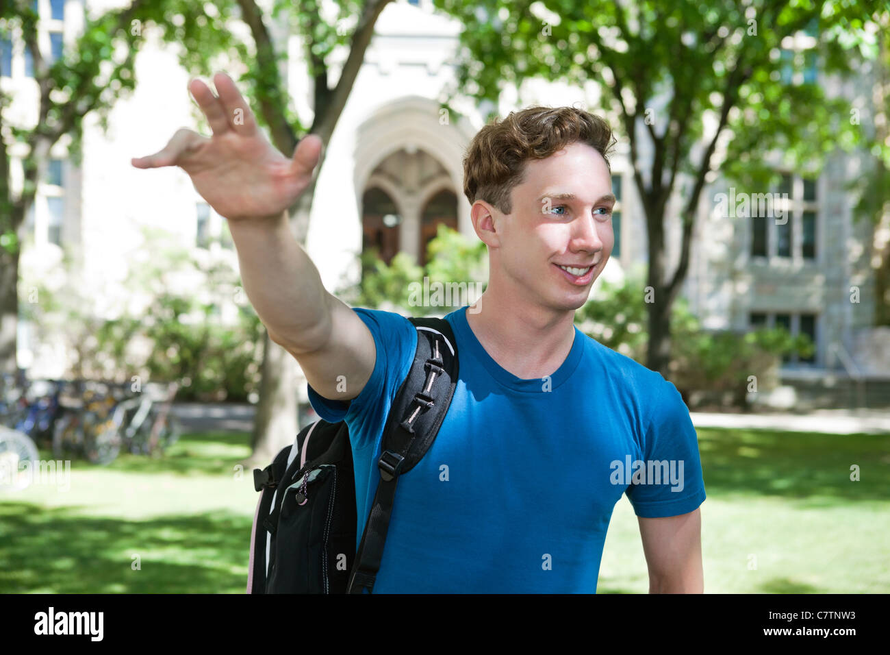 Young adult campus waving hi-res stock photography and images - Alamy