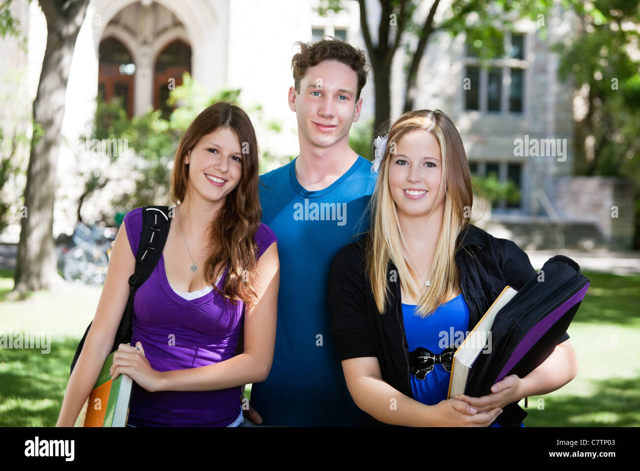 Group portrait of three college students Stock Photo - Alamy