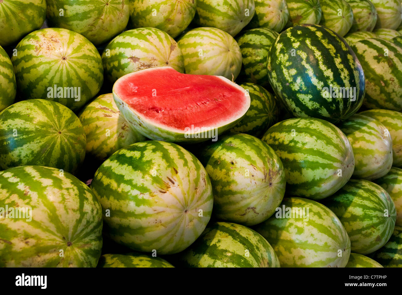 lot of water melons watermelons one opened melon Stock Photo - Alamy