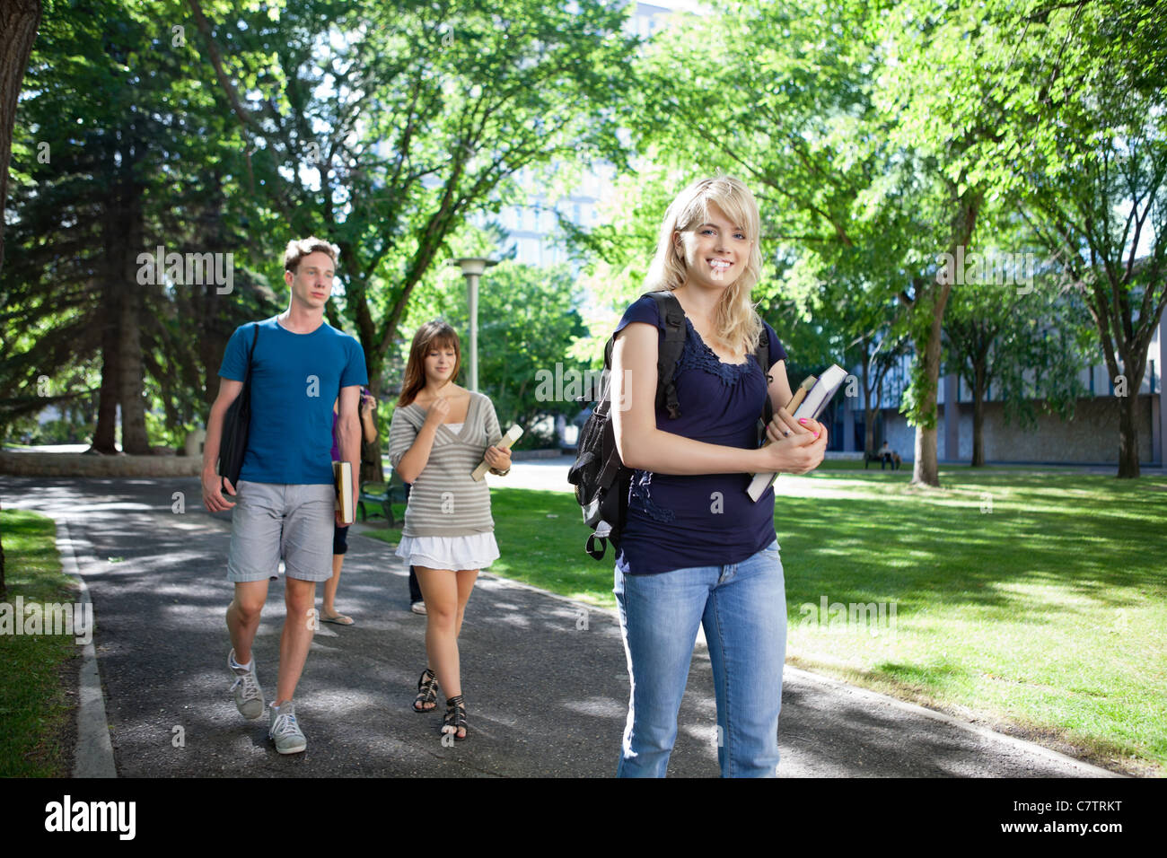 Group of students on their way to class walking through campus Stock ...