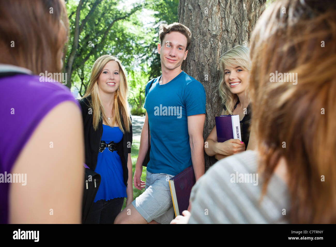 Group of college students relaxing outdoors Stock Photo - Alamy