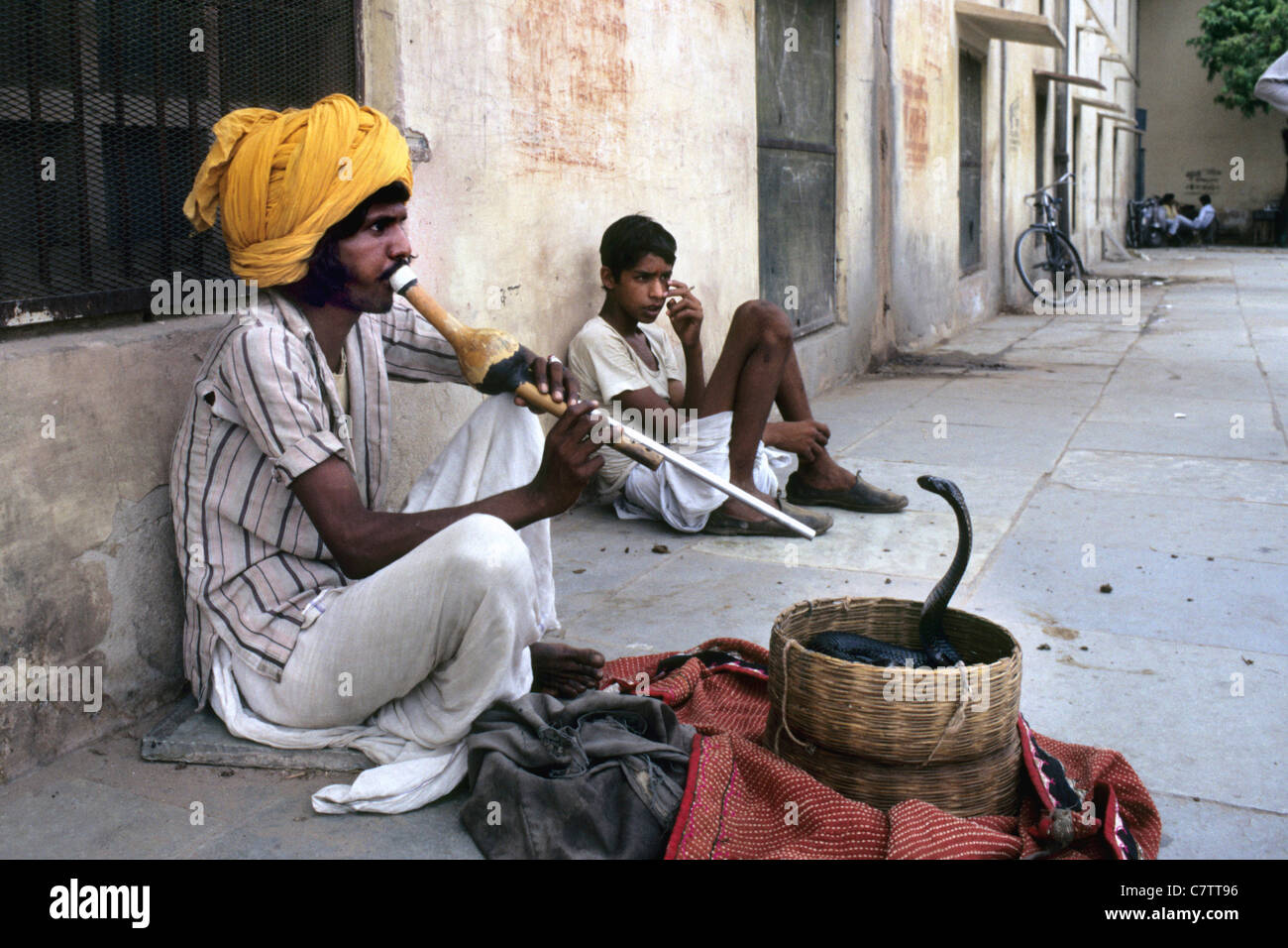 Male snake charmer plays tune hi-res stock photography and images - Alamy