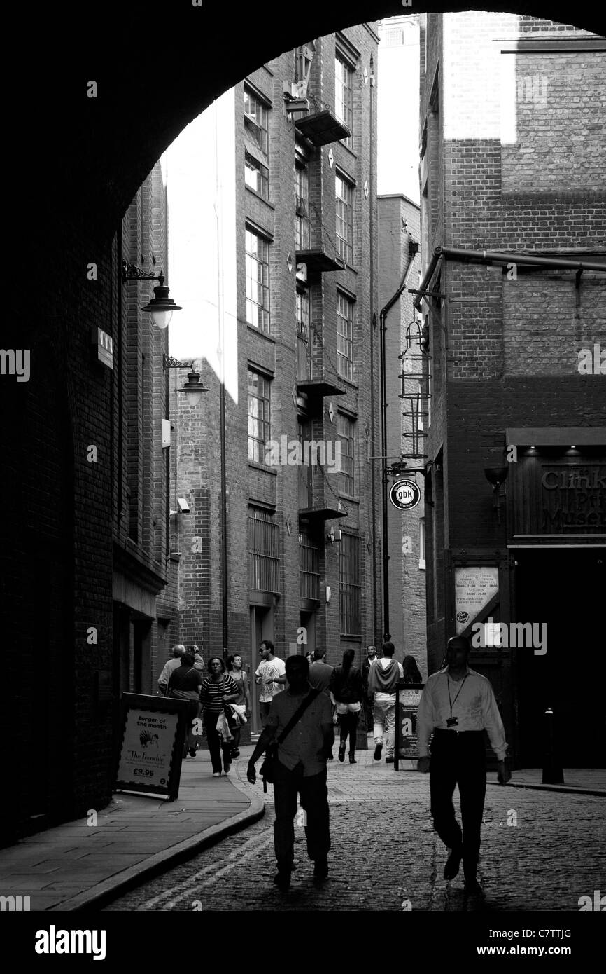 Clink street London, Clink prison and tall warehouses Stock Photo - Alamy