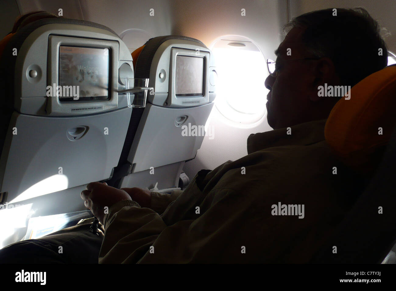 Passengers seated airplane cabin hi-res stock photography and images ...