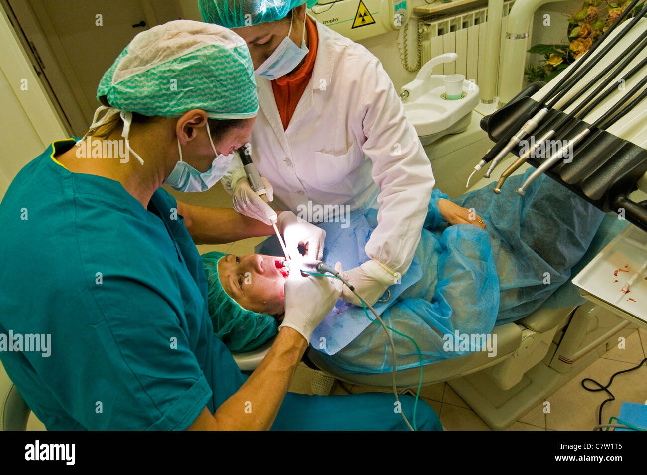 Patient receiving dental treatment Stock Photo - Alamy