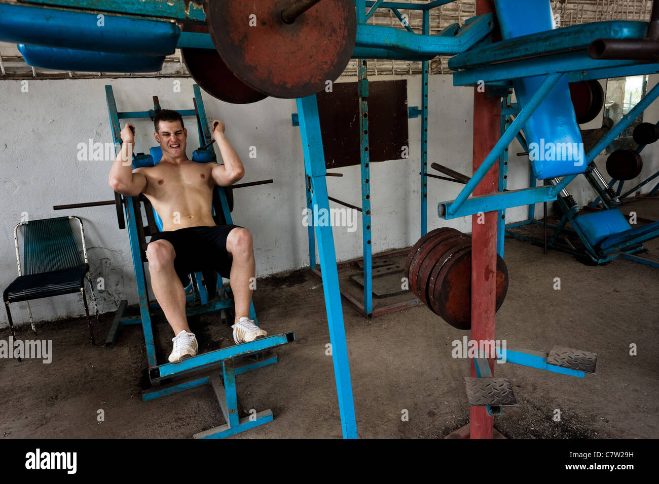 A young Cuban man works out at a bodybuilding gym in Alamar, a public ...
