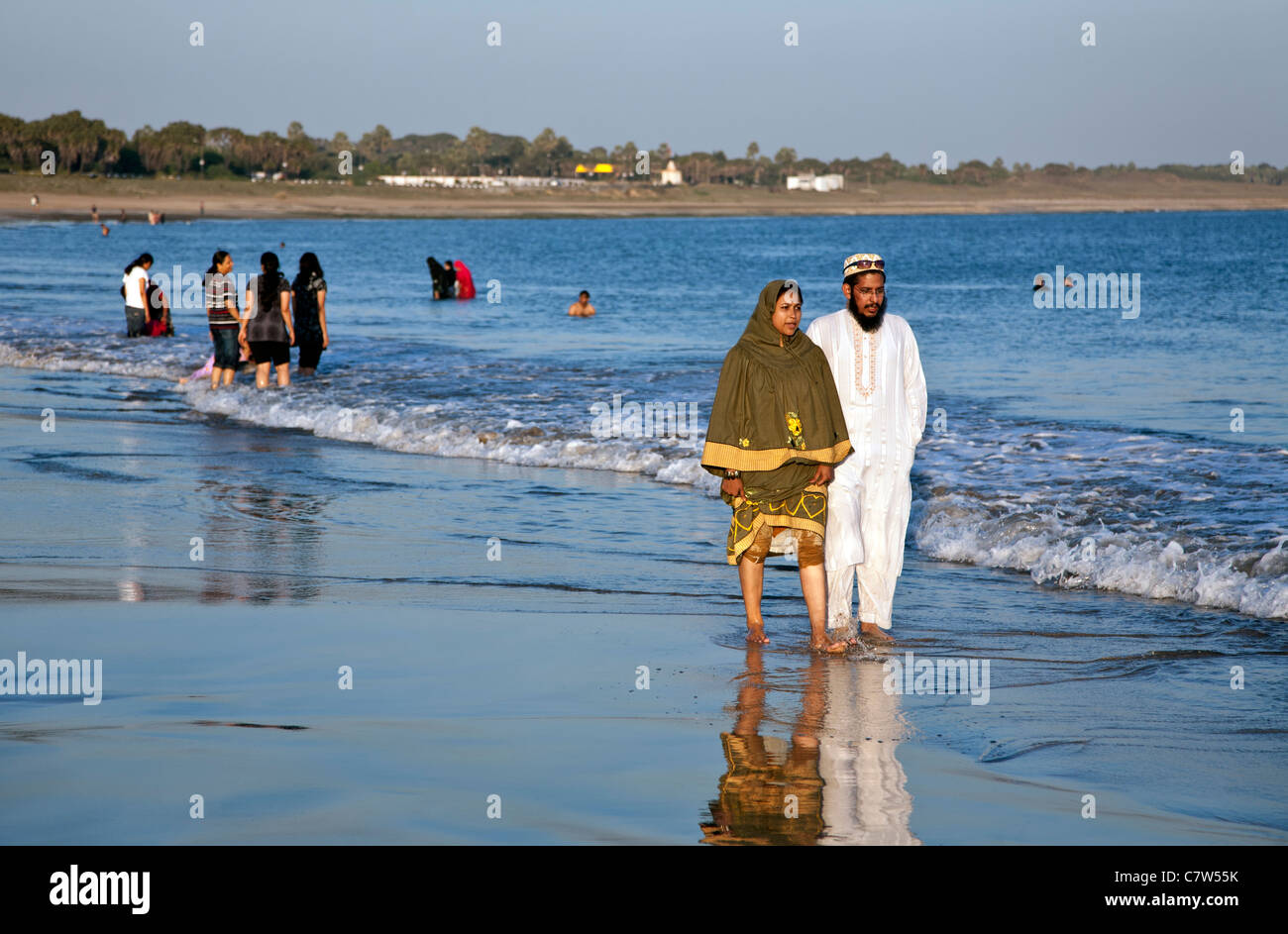 Muslim couple waking on the beach. Diu. Daman and Diu territory. India ...