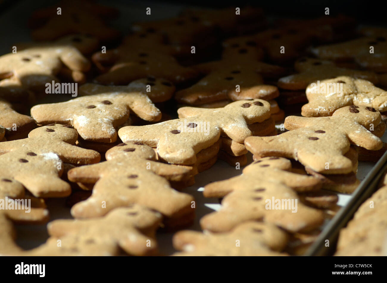 Ginger bread men on baking tray Stock Photo - Alamy