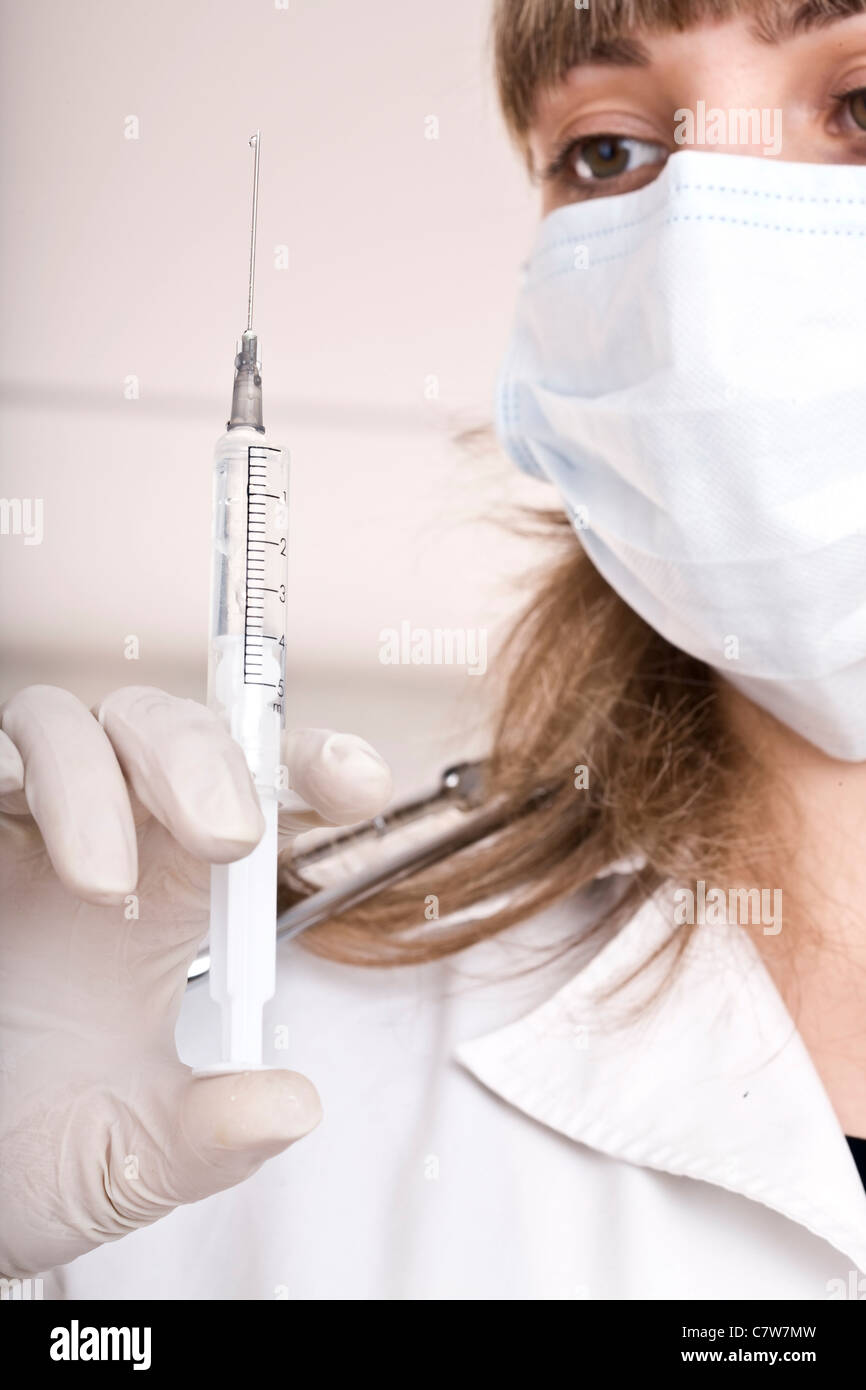 Medicine doctor with syringe in office Stock Photo - Alamy