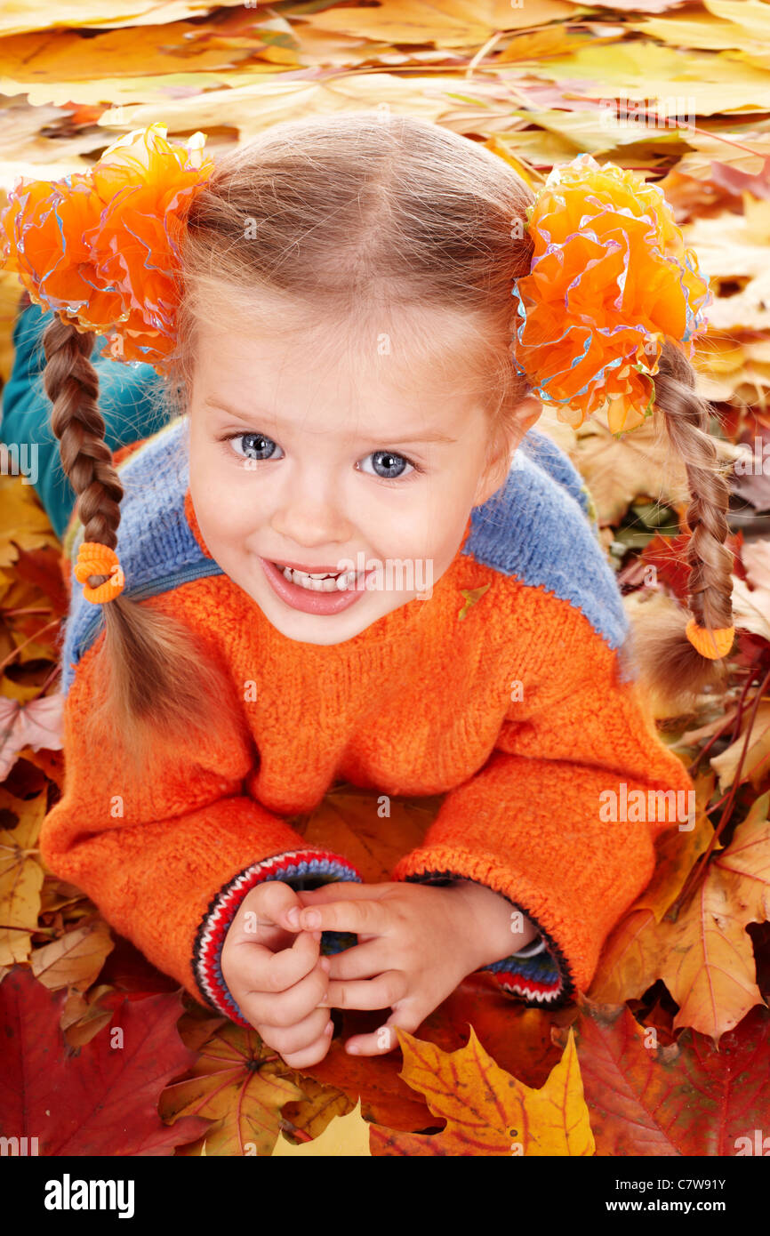 Child in autumn orange leaves. Outdoor Stock Photo - Alamy