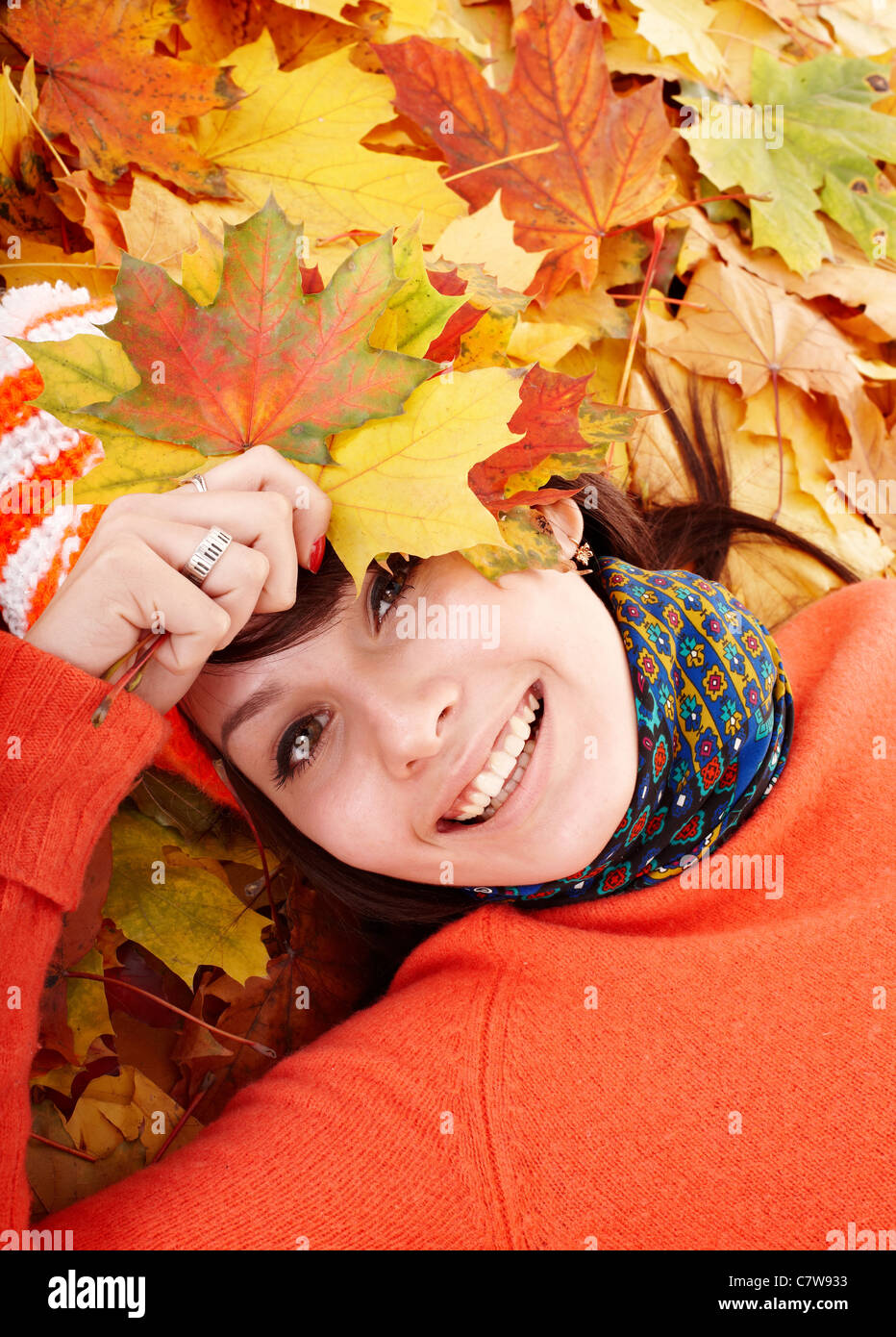 Young woman in autumn orange leaves. Outdoor Stock Photo - Alamy