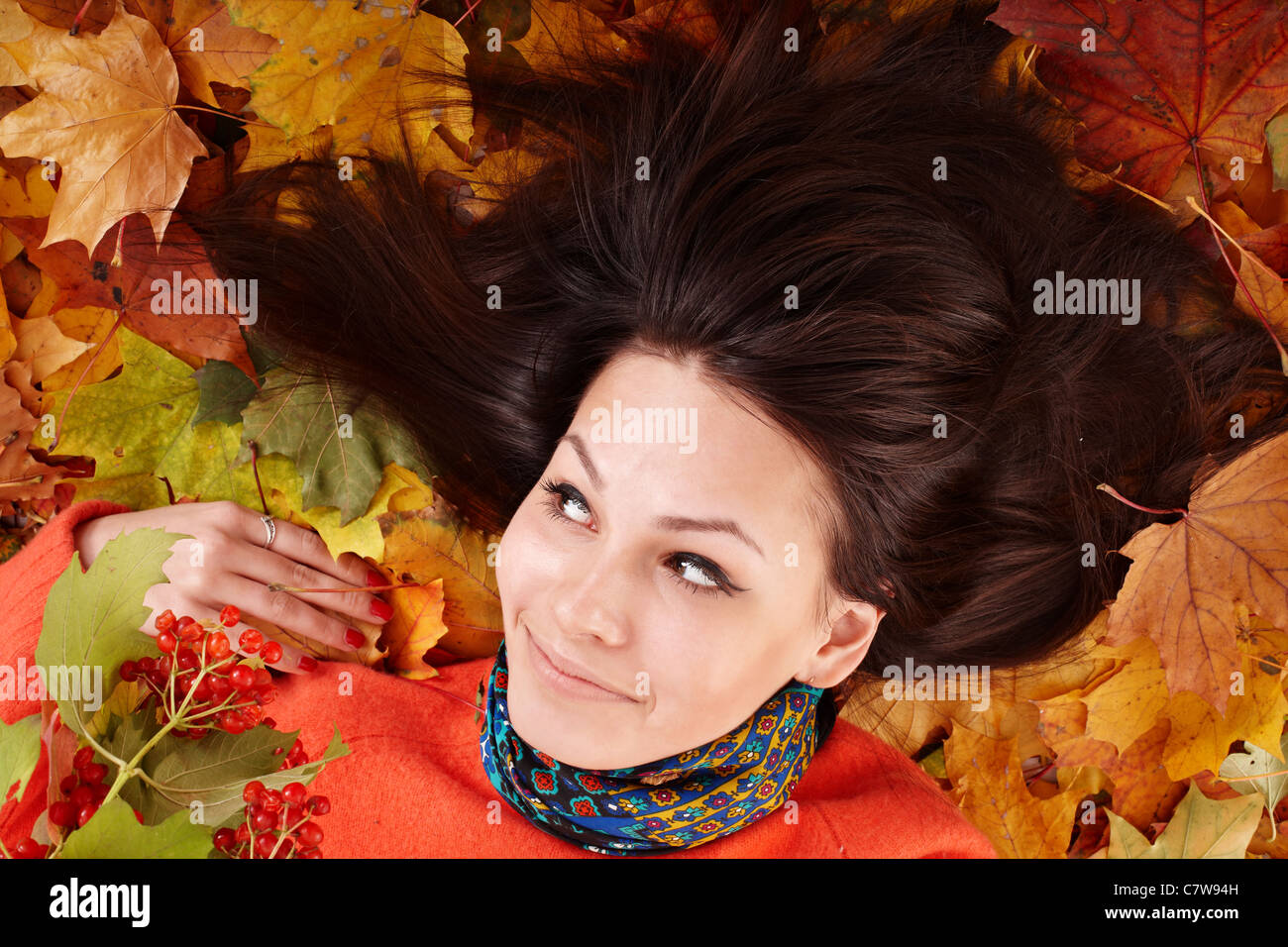 Young woman in autumn orange leaves. Outdoor Stock Photo - Alamy