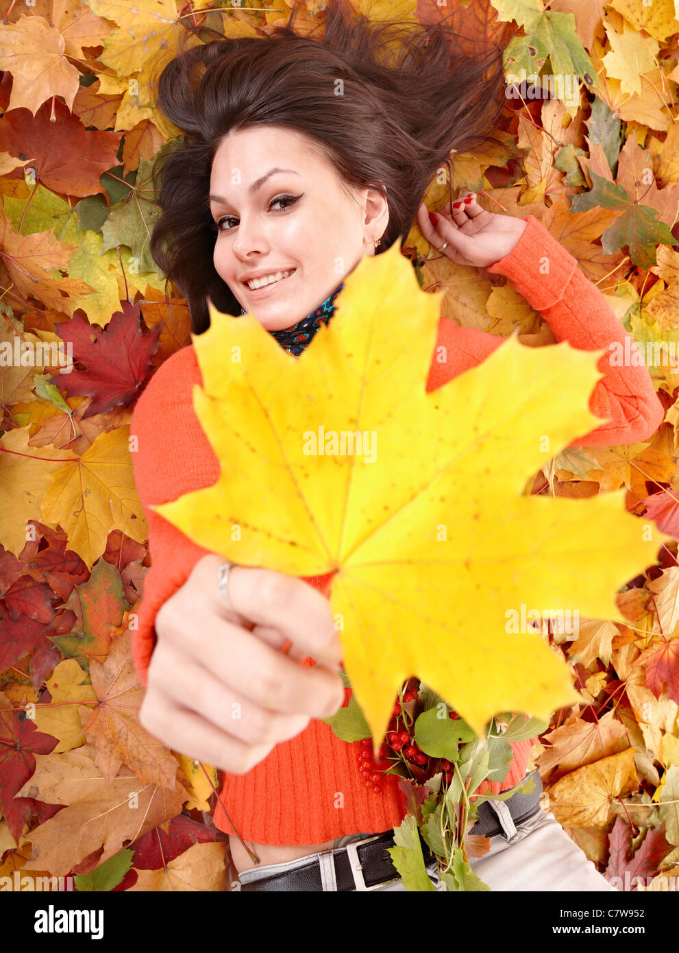Young woman in autumn orange leaves. Outdoor Stock Photo - Alamy